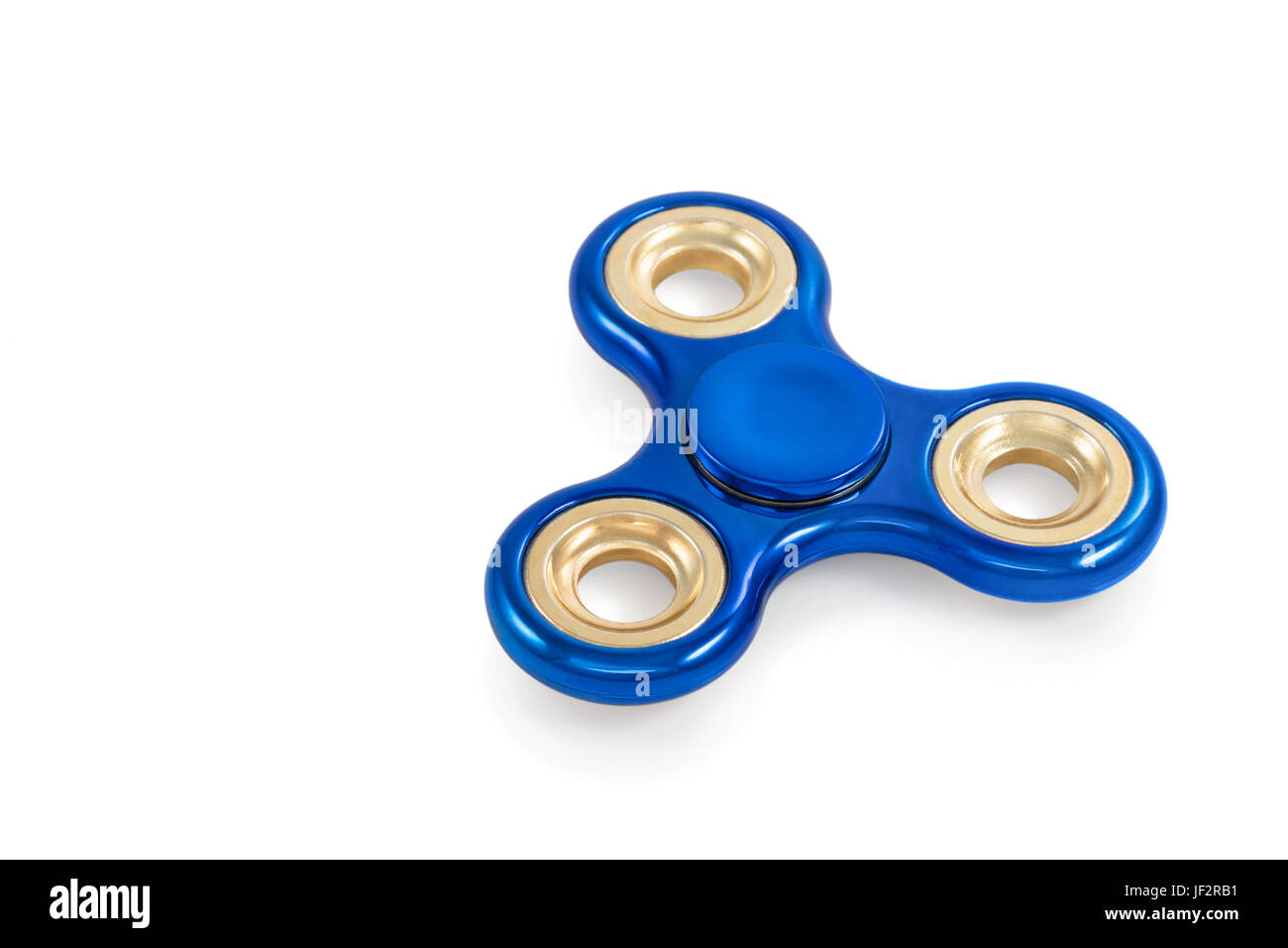 Blue shiny spinner lies on a flat surface isolated on a white ...