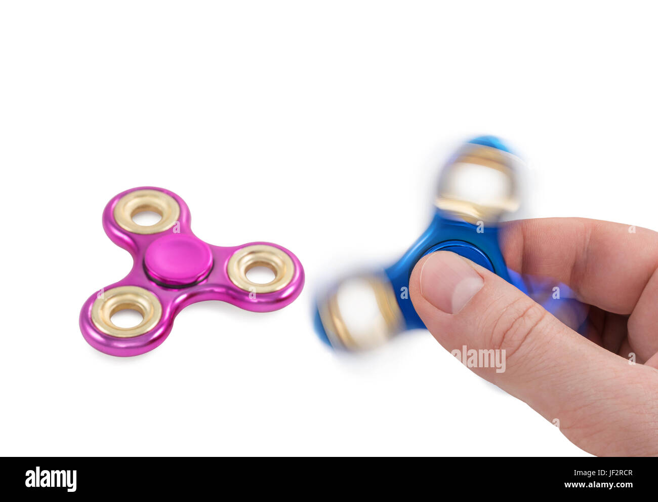 Blue spinner spinning, fingers compressed male hands, close-up ...