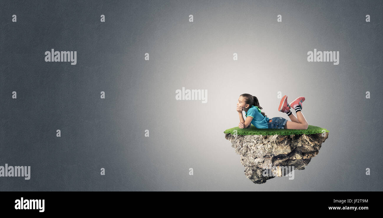 Cute kid girl on floating island and looking away Stock Photo - Alamy