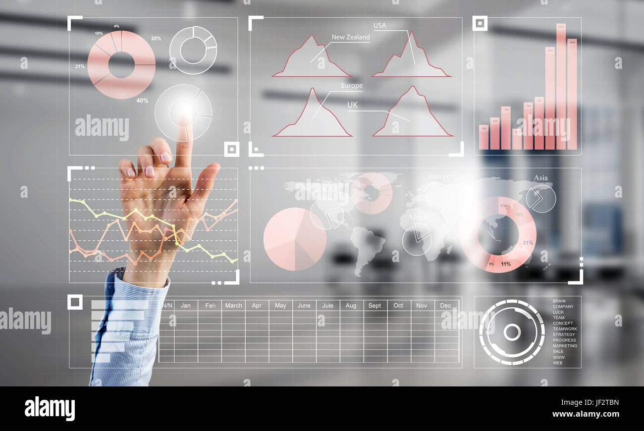 Hand of businesswoman working with media interface on screen and office ...