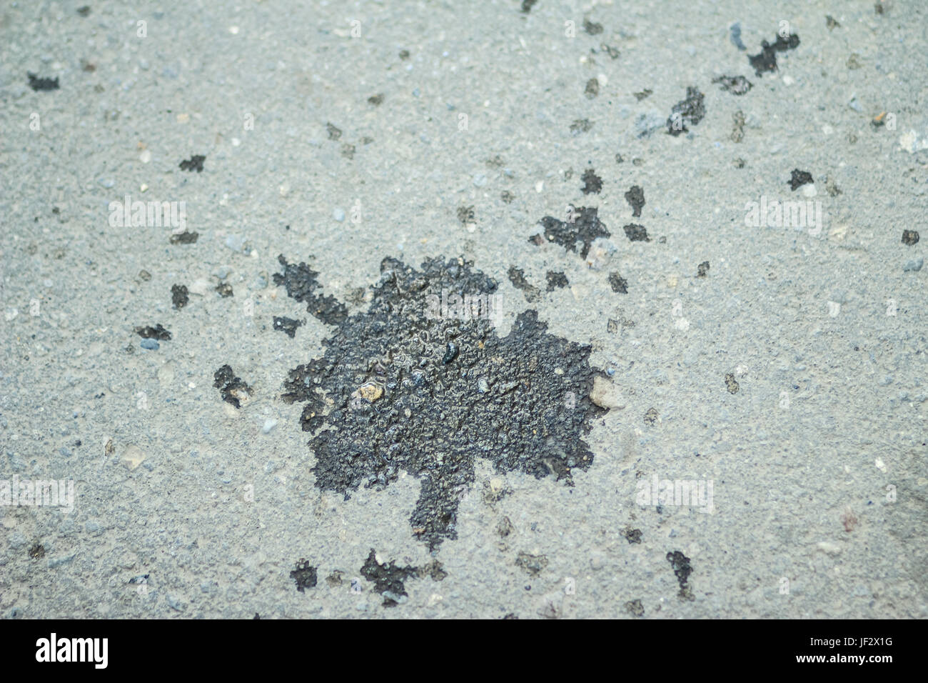 Gasoline spot on the sidewalk Stock Photo - Alamy