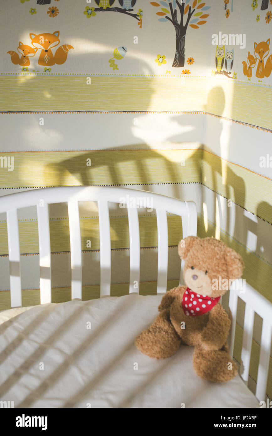 Teddy bear in a baby room Stock Photo - Alamy