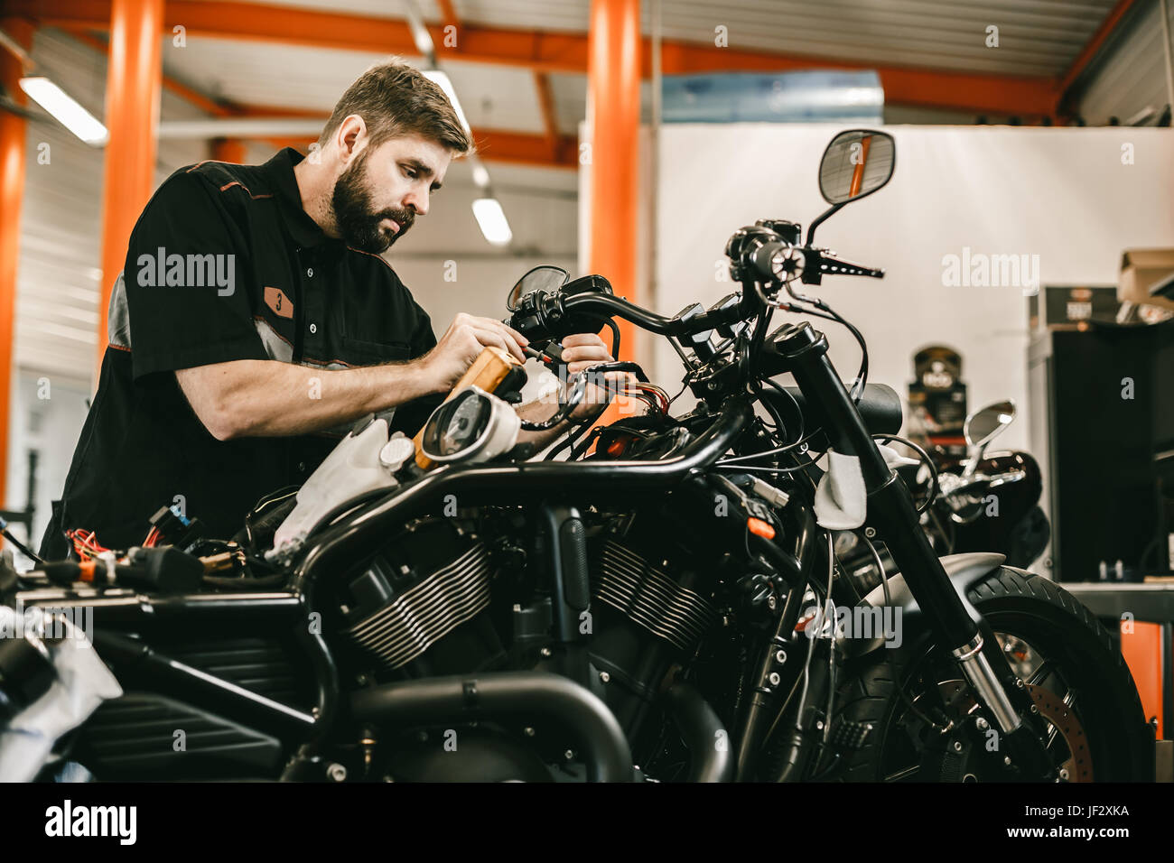 Black man repair shop worker hi-res stock photography and images - Alamy