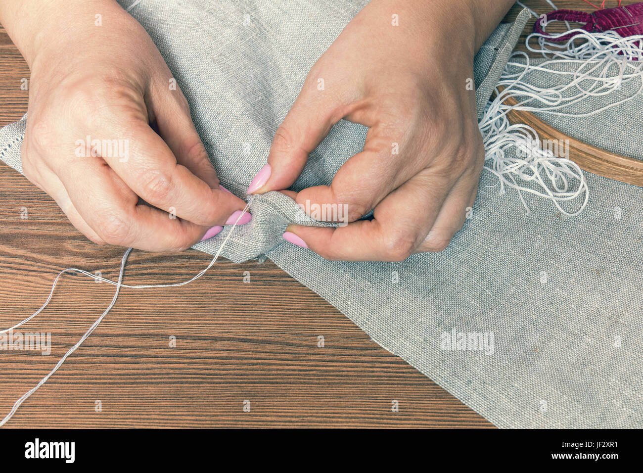 Woman hands doing openwork embroidery Stock Photo - Alamy