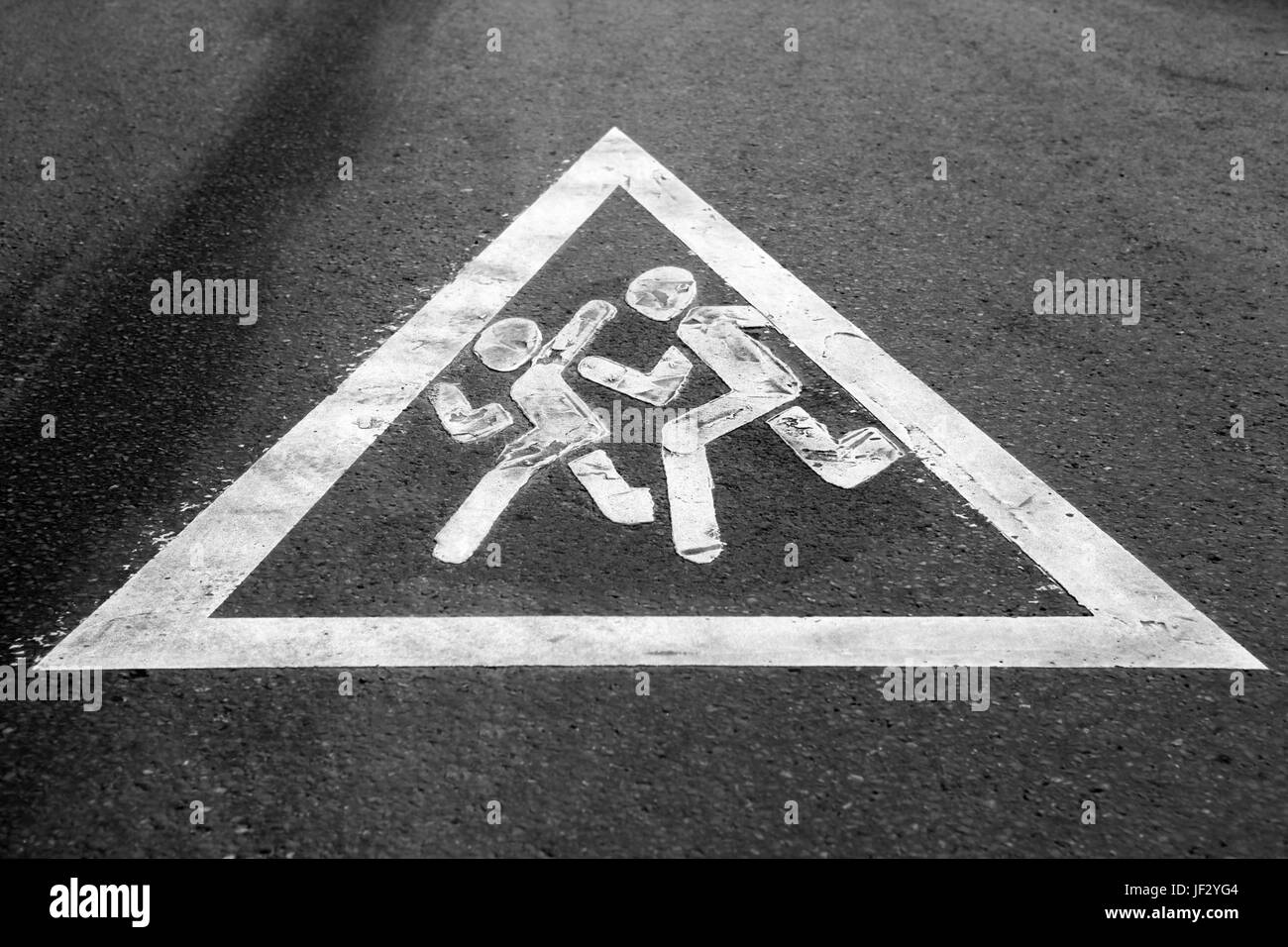 Road sign painted on the pavement Stock Photo - Alamy