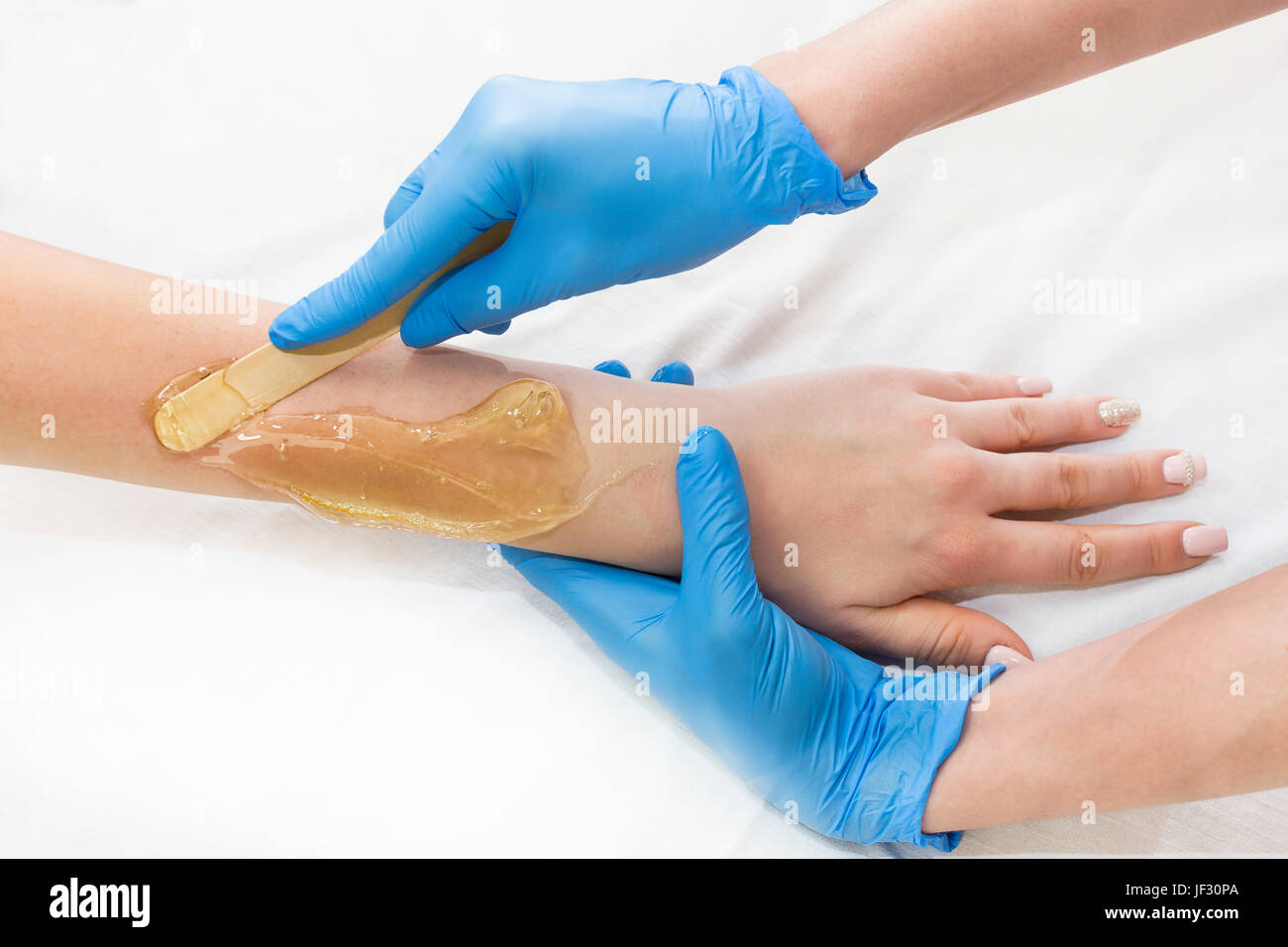 Depilation sugar processes woman hi-res stock photography and images ...