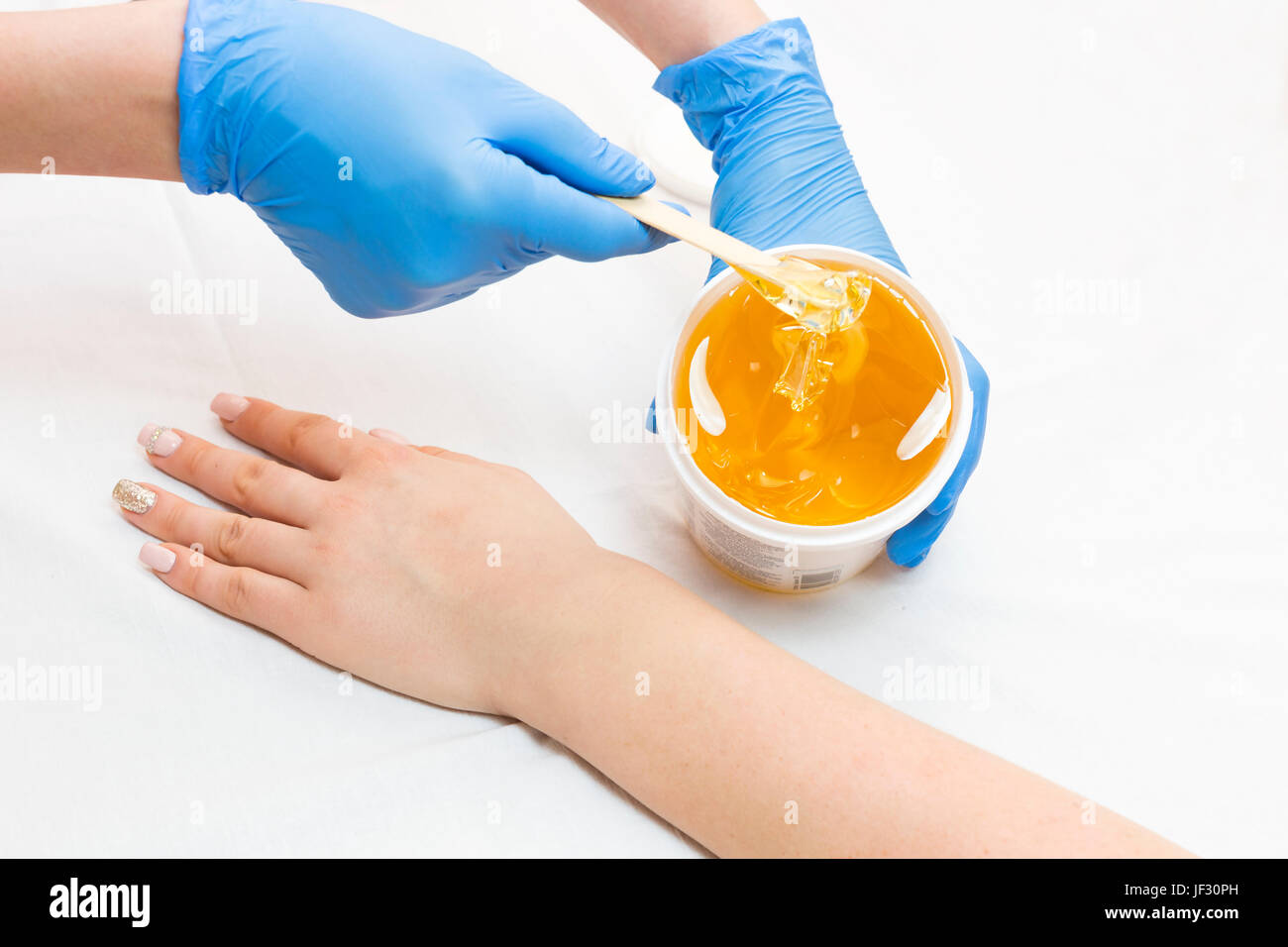 Depilation sugar processes woman hi-res stock photography and images ...