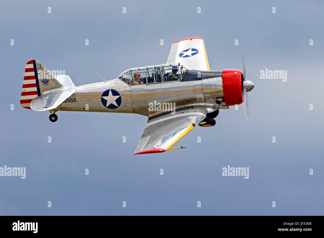 Airplane T-6 Texan SNJ aircraft flying at air show Stock Photo - Alamy