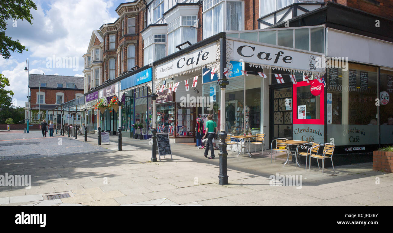 Parade of shops with glazed ironwork awnings, Lord Street, Southport ...