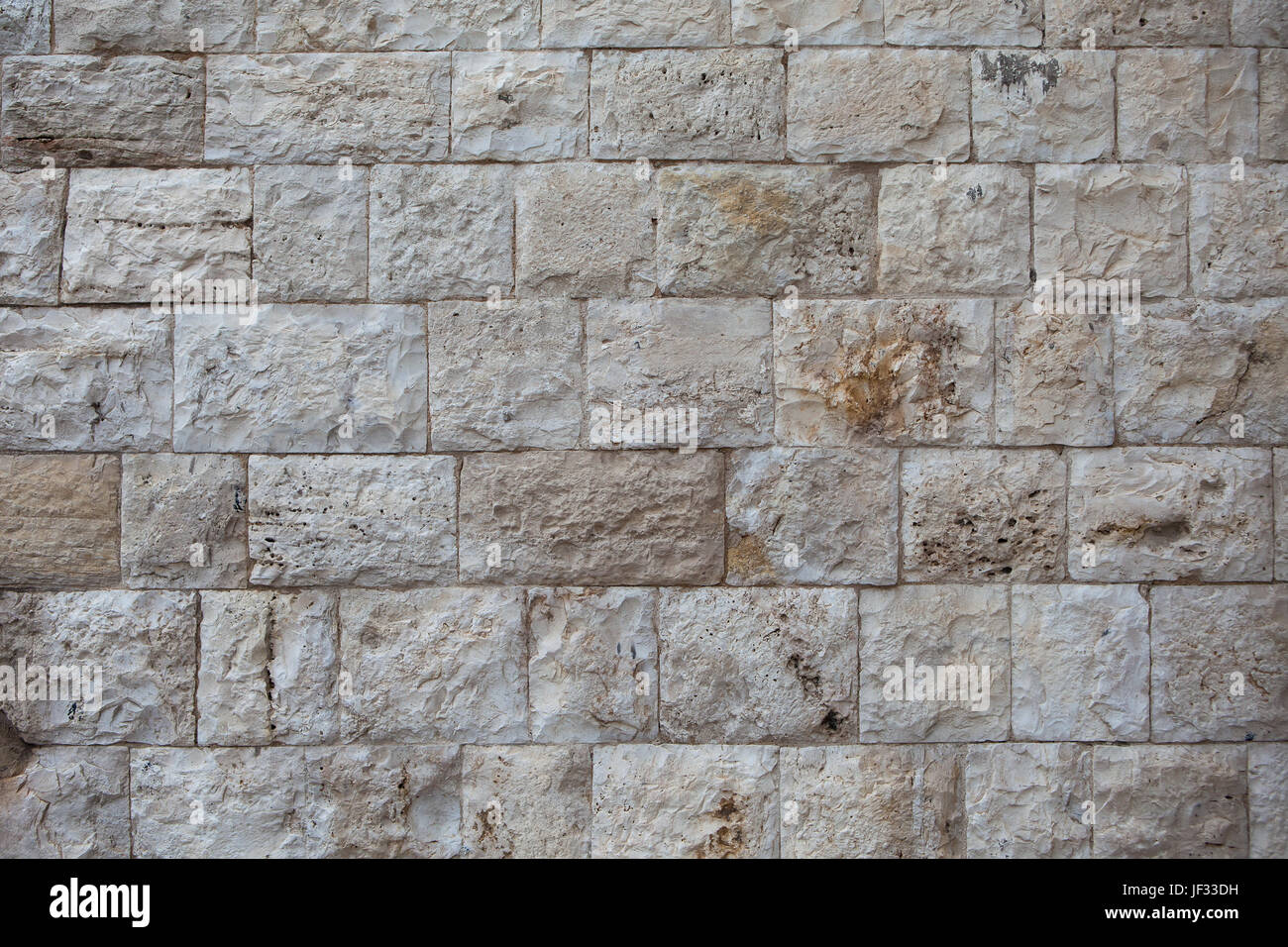 Old wall made of light stones Stock Photo - Alamy