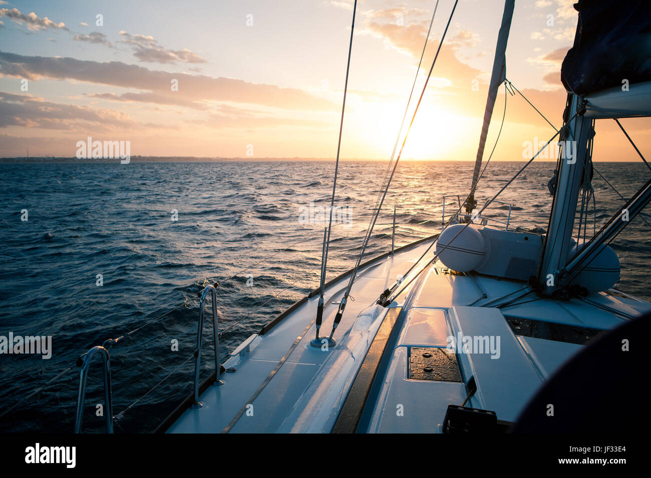 Yacht at sunset hi-res stock photography and images - Alamy