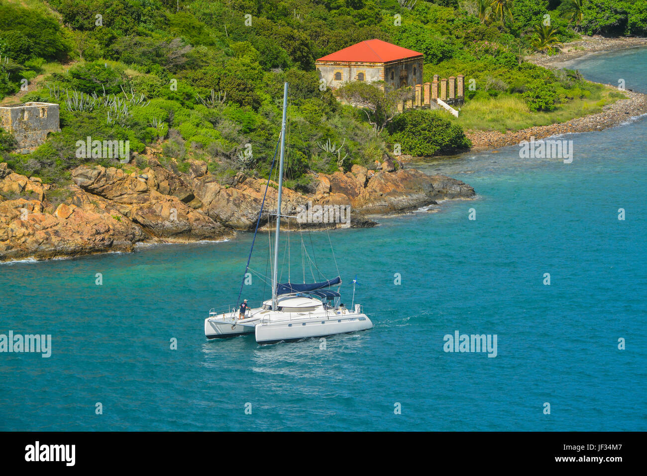 Catamaran sailing by Garrison House at Fort Willoughby on Hassel Island ...