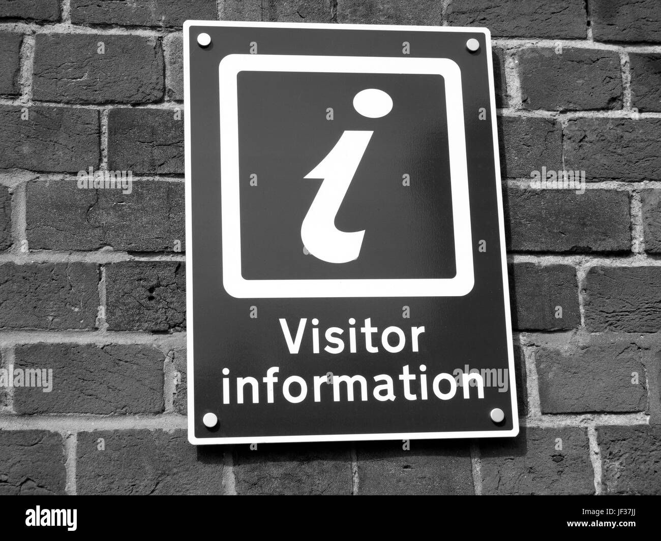 Visitor Information sign mounted on brick wall Stock Photo - Alamy