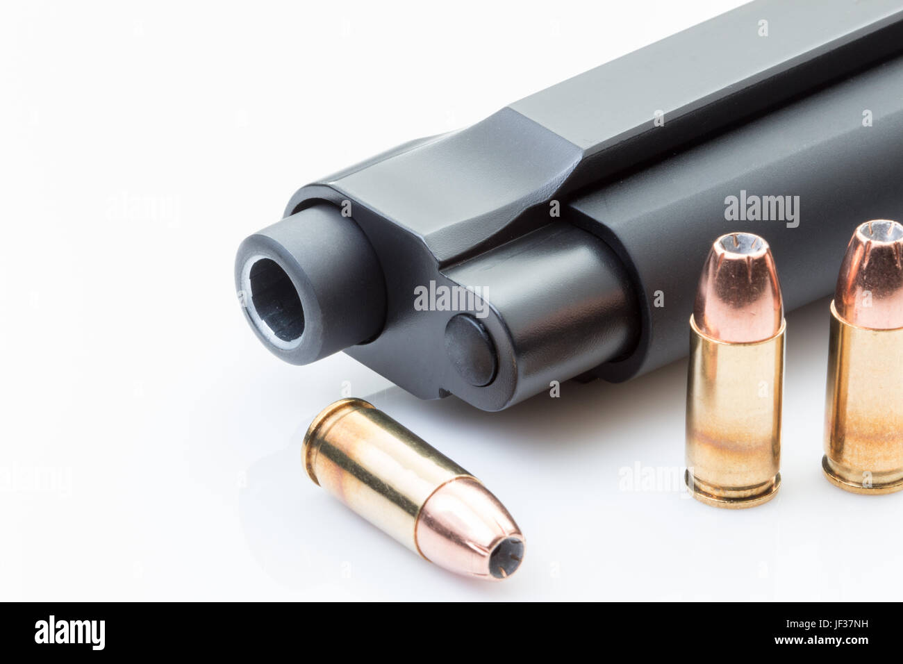 Handgun barrel and bullets on white background Stock Photo - Alamy