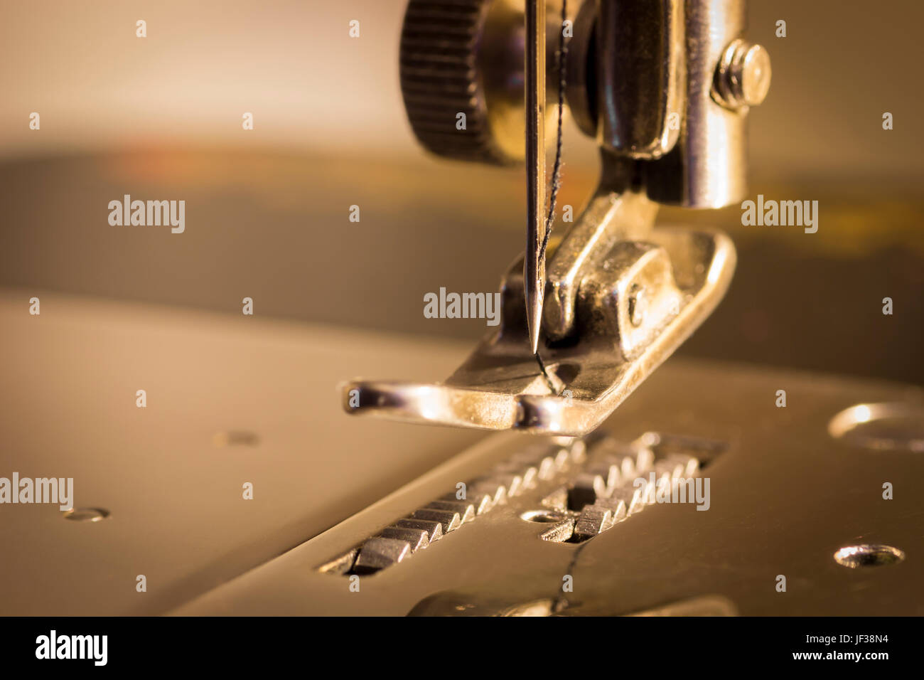 The needle of the sewing machine close-up Stock Photo - Alamy