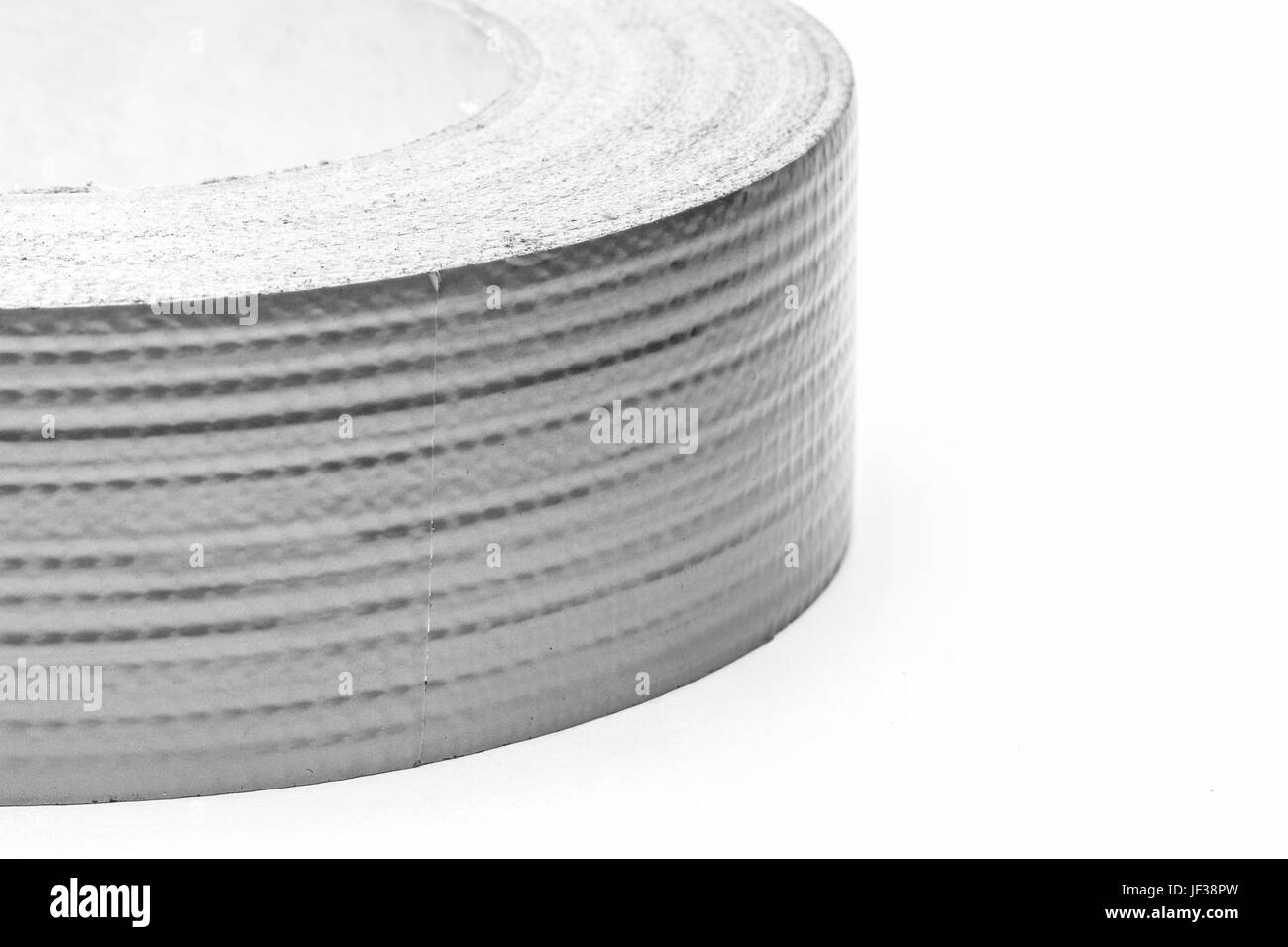 Construction and assembly adhesive tape close-up on a white background ...