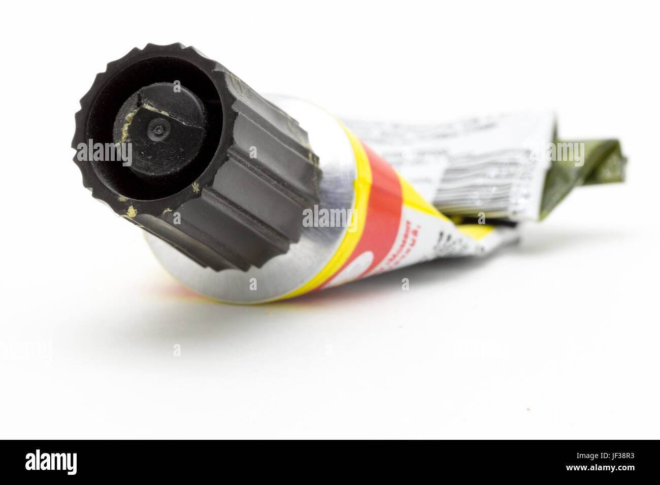 An empty tube of glue closeup on a white background Stock Photo - Alamy
