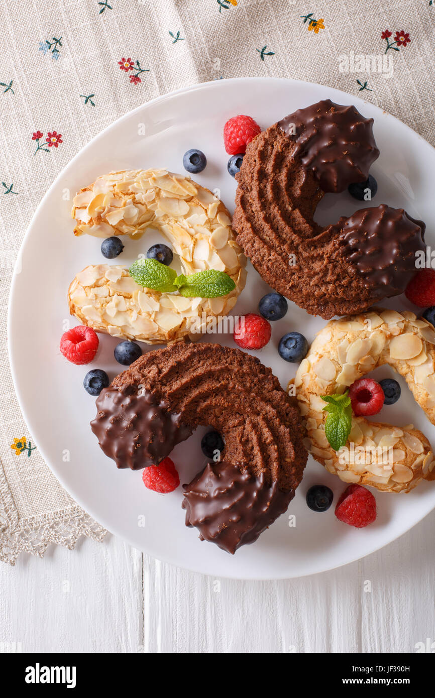 Festive almond and chocolate cookies in the shape of a horseshoe close ...