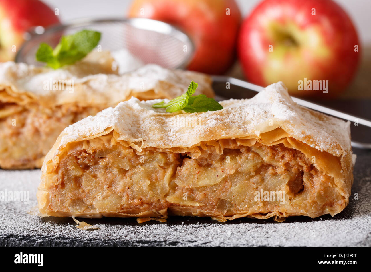 Traditional Austrian apple strudel close-up on the board. horizontal ...