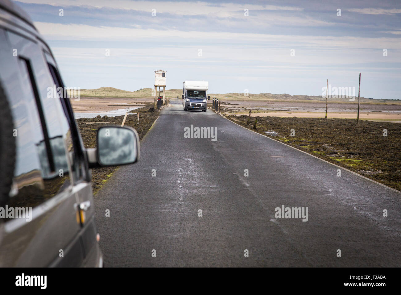 Tidal causeway leading on to Holy Island, Lindisfarne, Northumberland ...