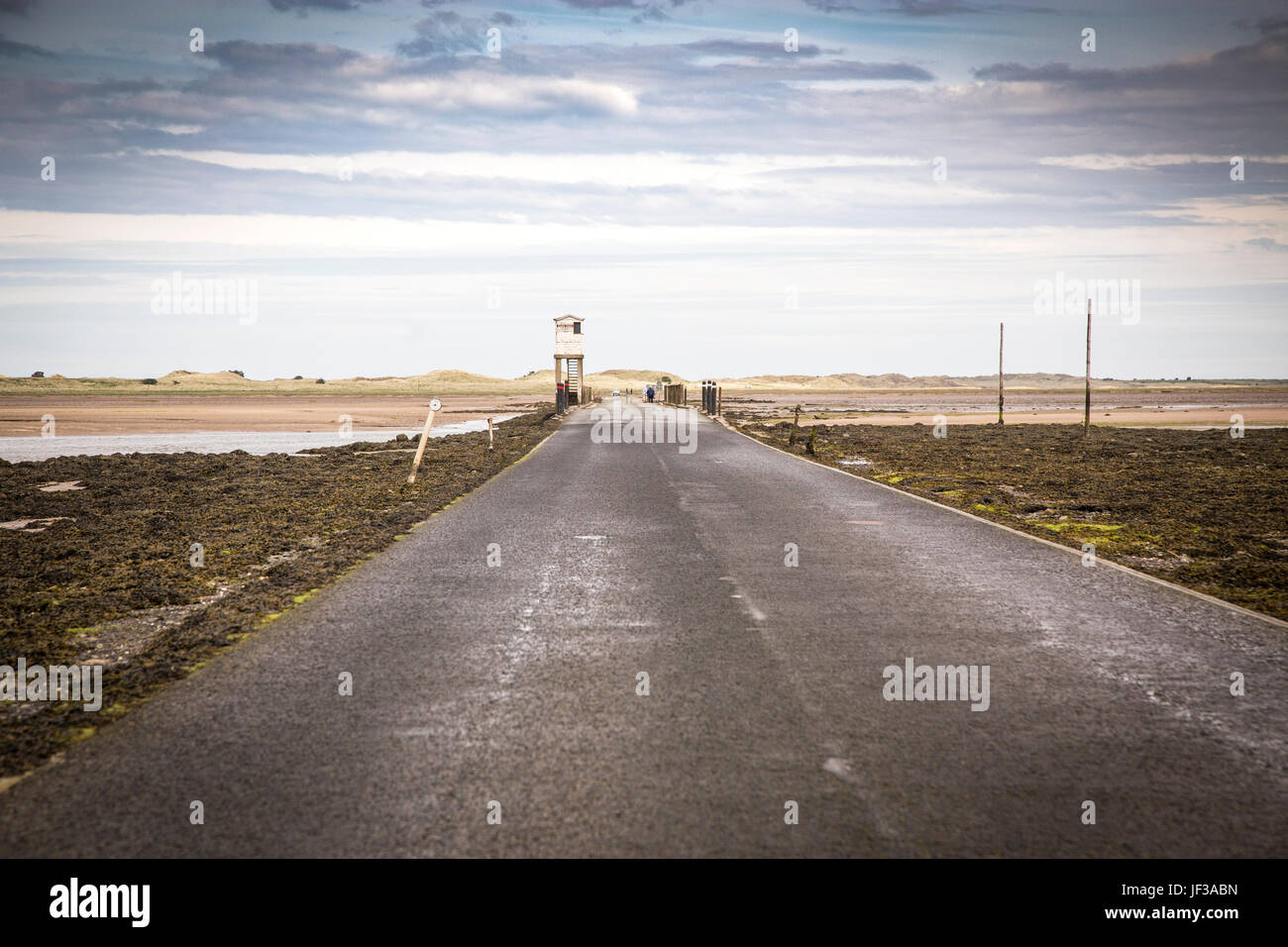 Tidal causeway leading on to Holy Island, Lindisfarne, Northumberland ...