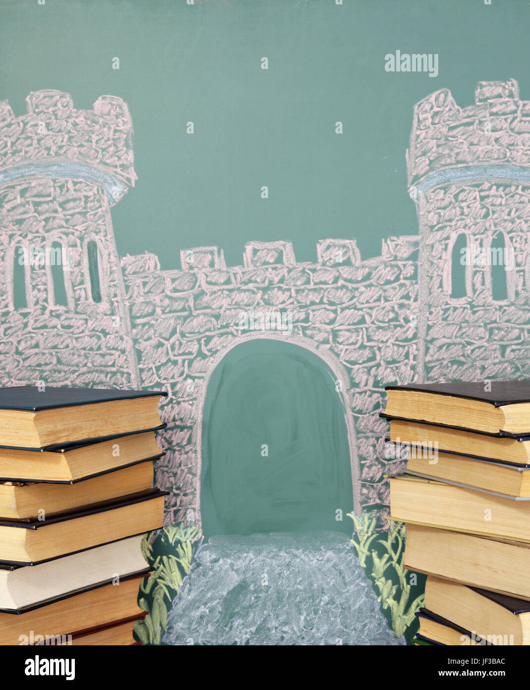Unusual literary concept. Chalk drawing of castle with books-towers and ...