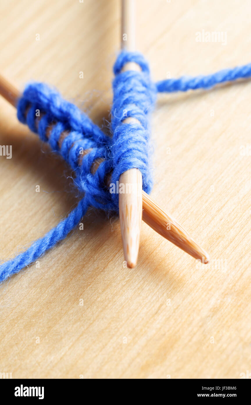 Crossed knitting needles hi-res stock photography and images - Alamy