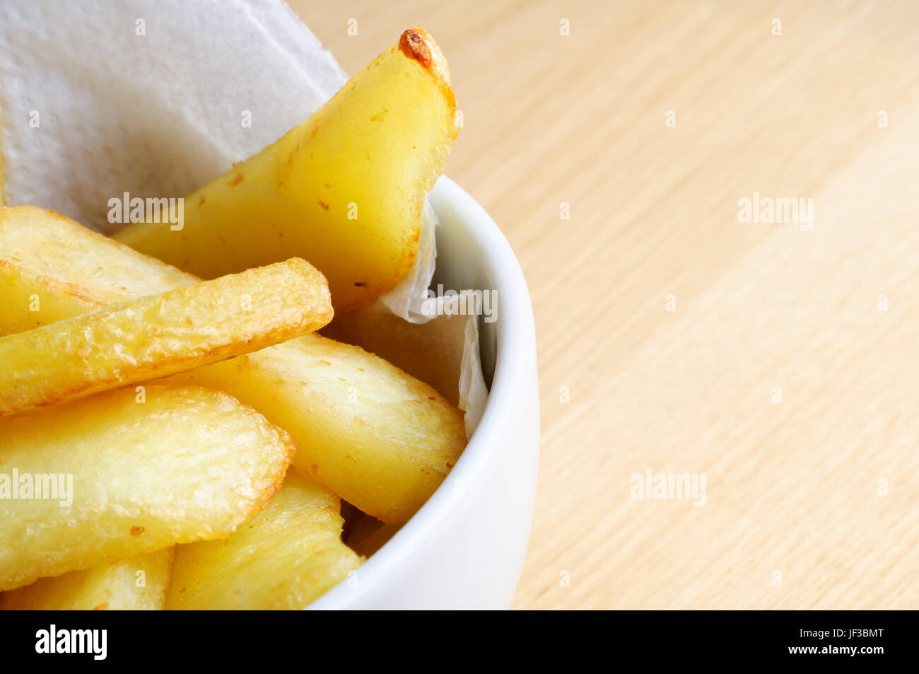 Close up (macro) of a bowl of chips (french fries) nestling on ...
