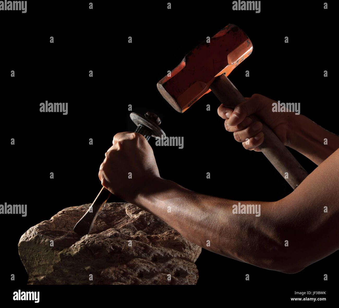 abstract of hand hammer and hard rock isolated on black use as fighting ...