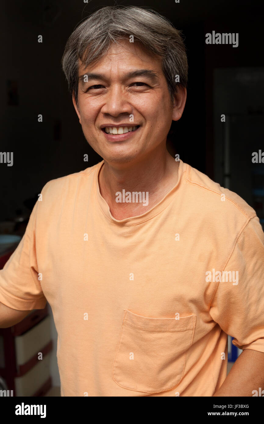 asian ,thai man toothy smiling face relaxing Stock Photo - Alamy