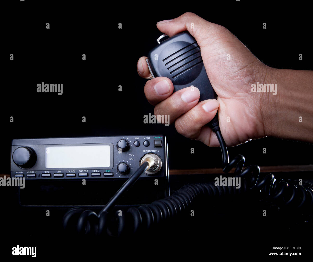 hand of Amateur radio holding speaker and press for radio communication ...