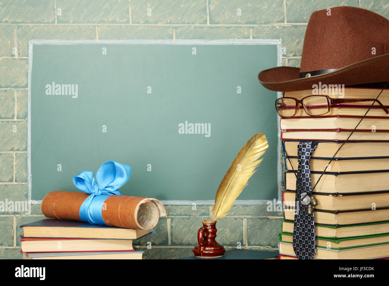 Unusual jesting teacher, books, quill pen, scroll before blackboard ...