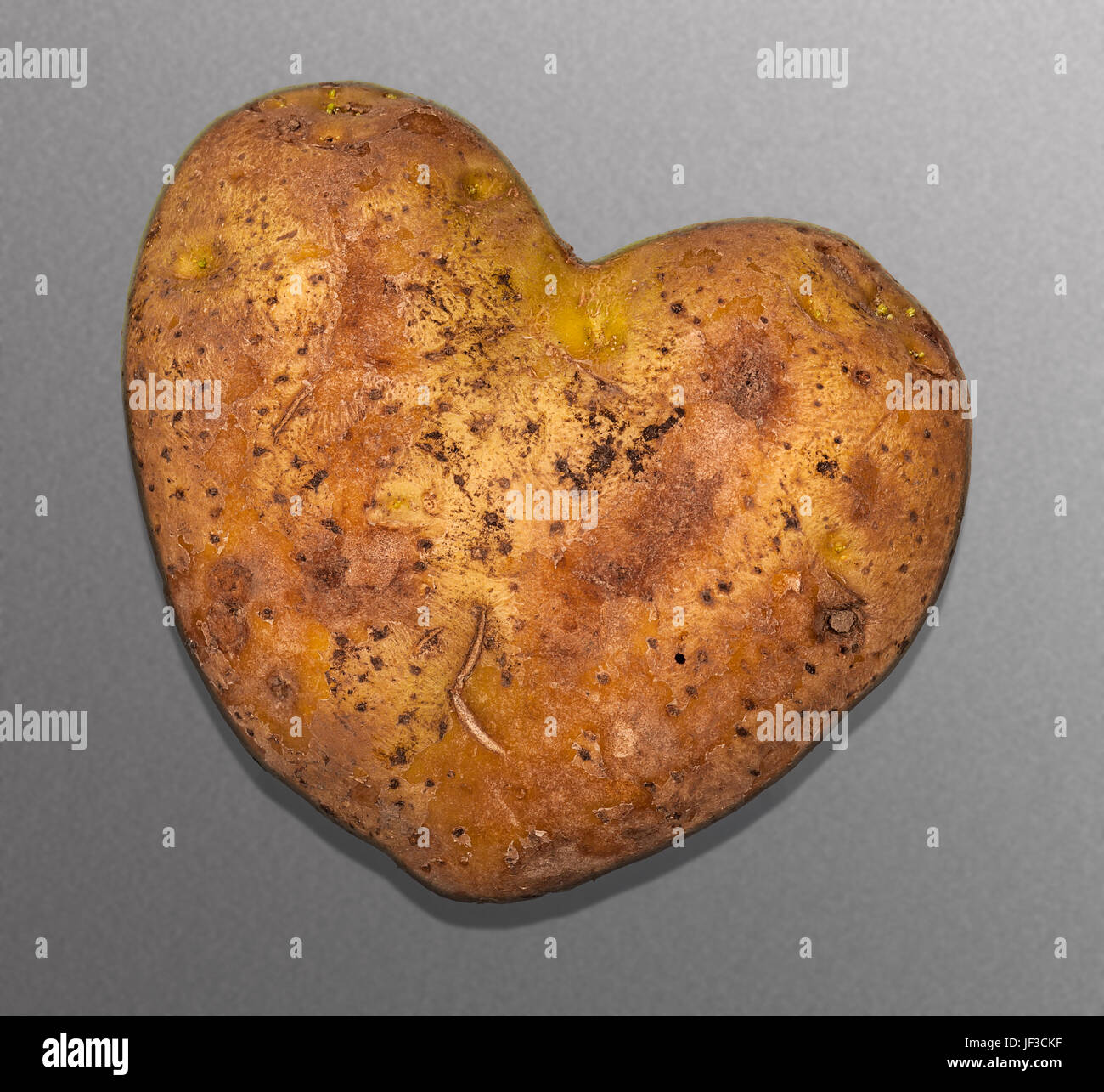 Potato heart shape with love on the table Stock Photo - Alamy