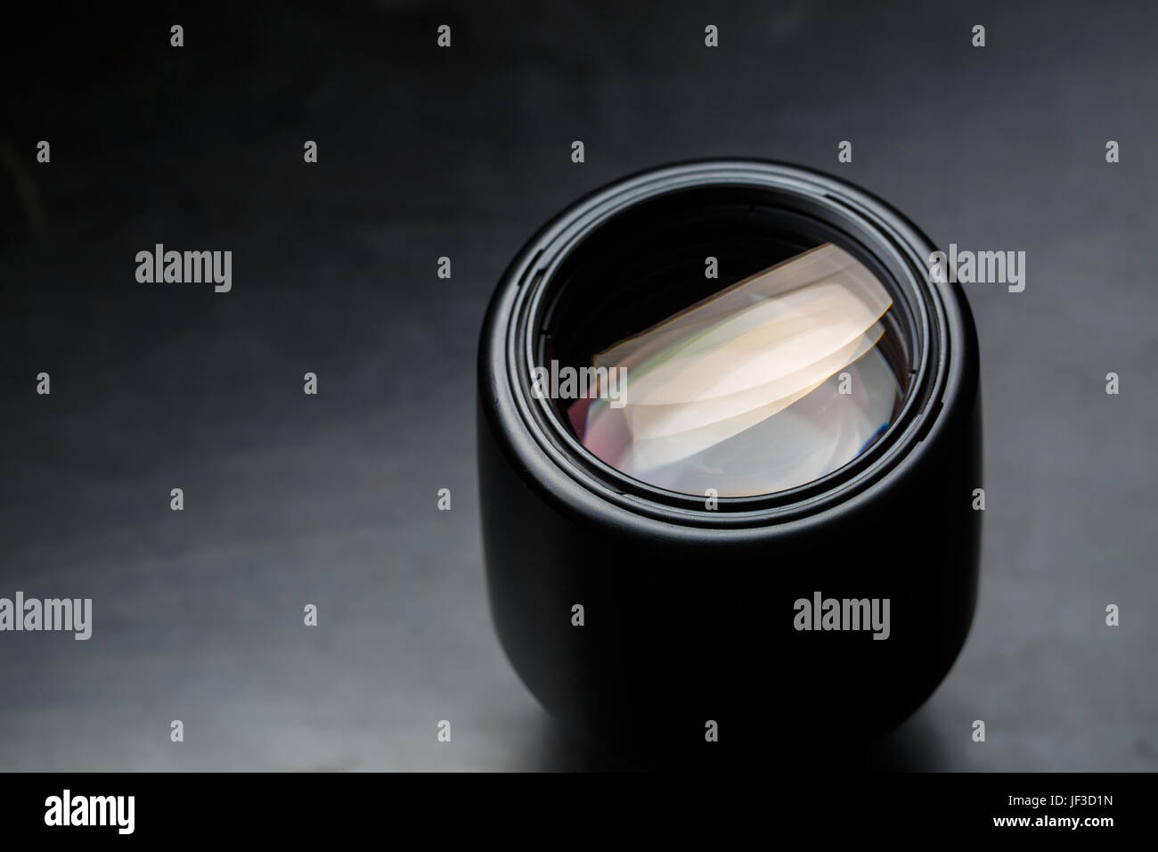 Photo of camera lens on empty black background Stock Photo - Alamy