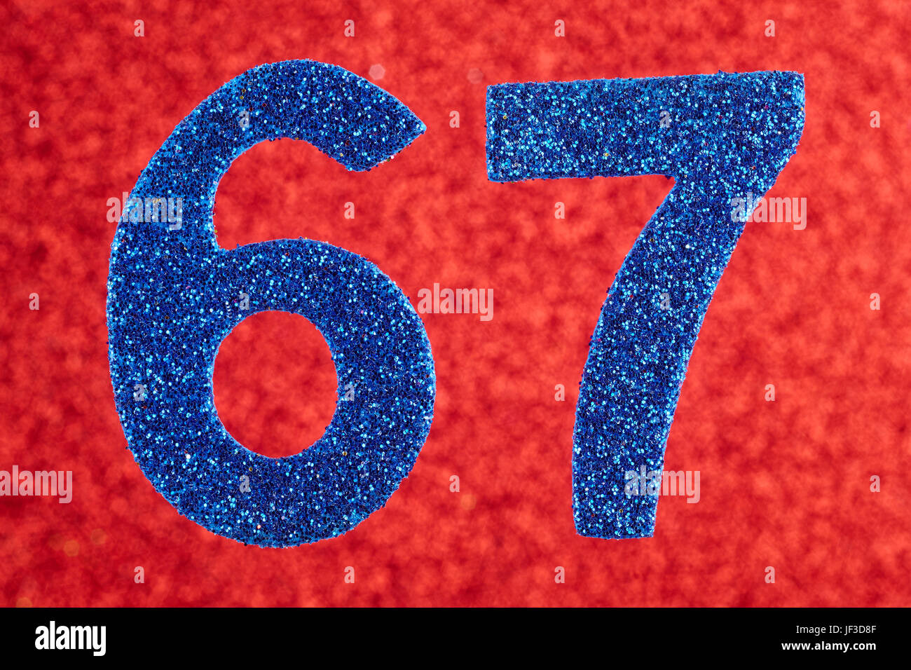 Number sixty-seven blue color over a red background. Anniversary ...
