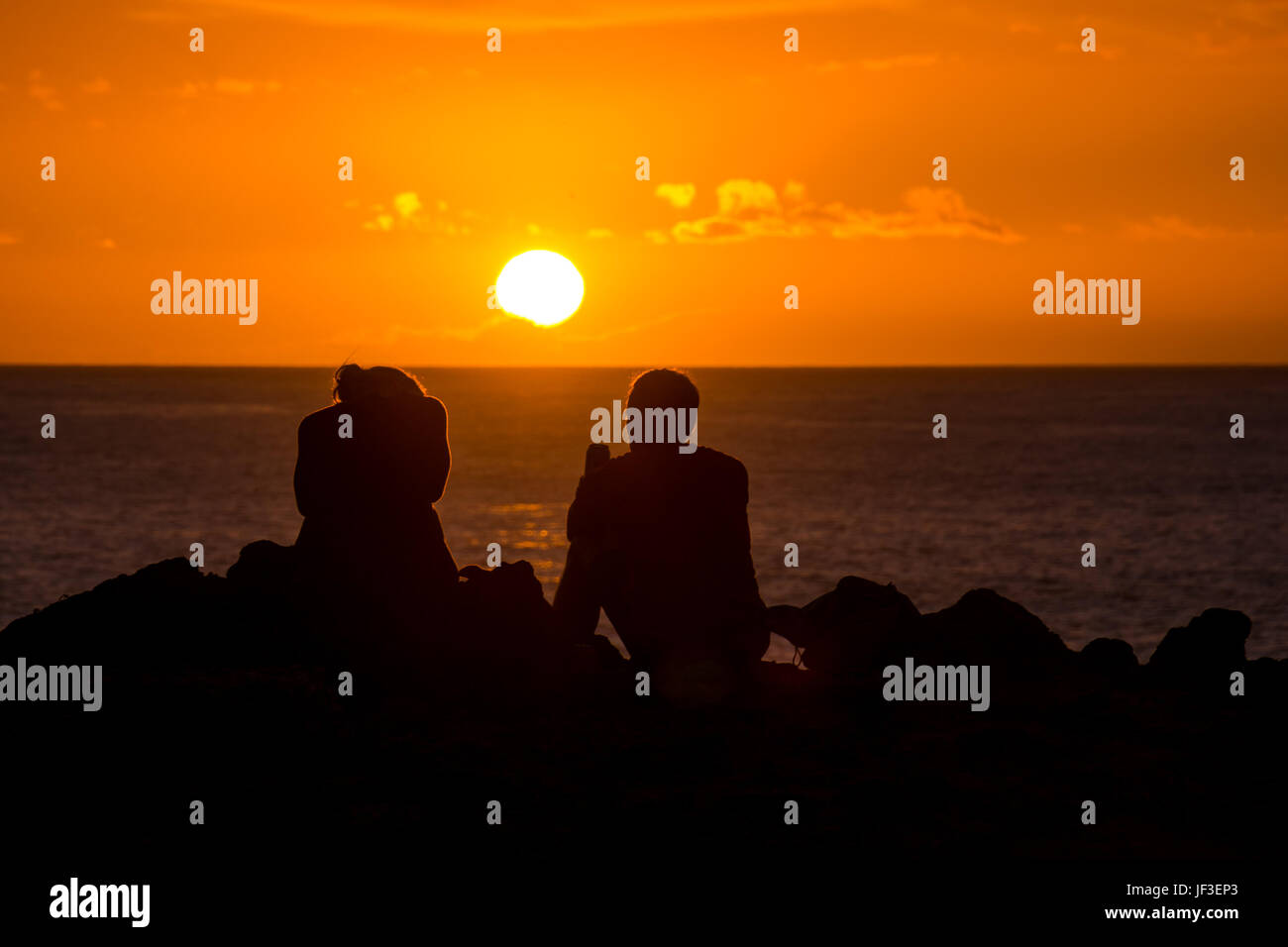 Sun Setting on the Ocean Stock Photo - Alamy