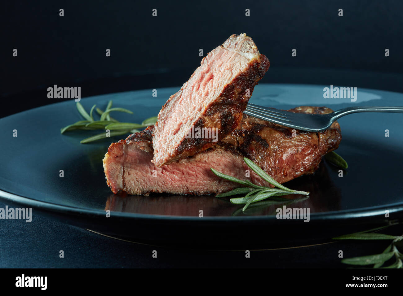 Succulent medium rare beef steak Stock Photo - Alamy