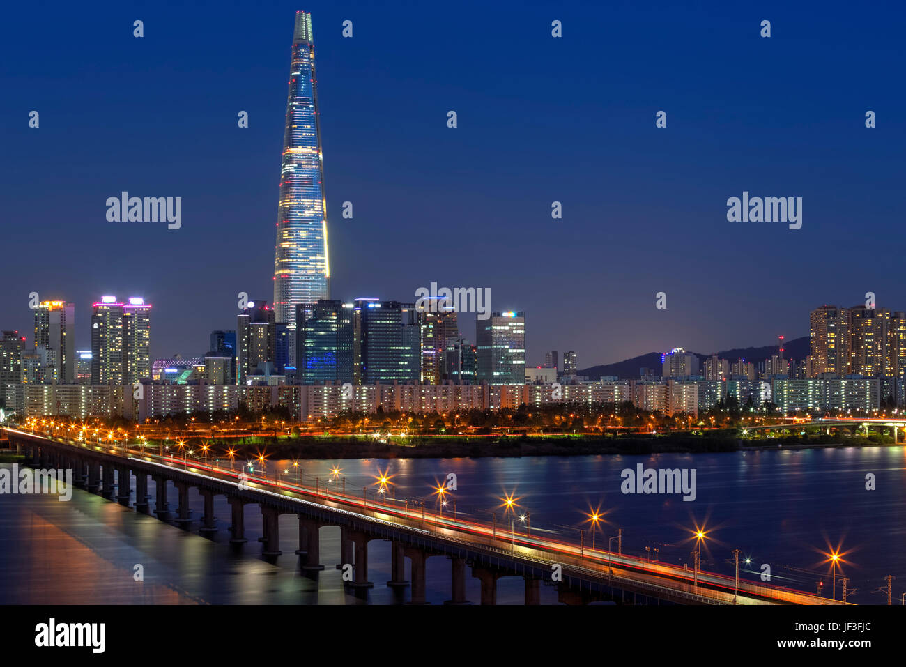 Jamsil bridge over Han River against Seoul Skyline at night. In the ...