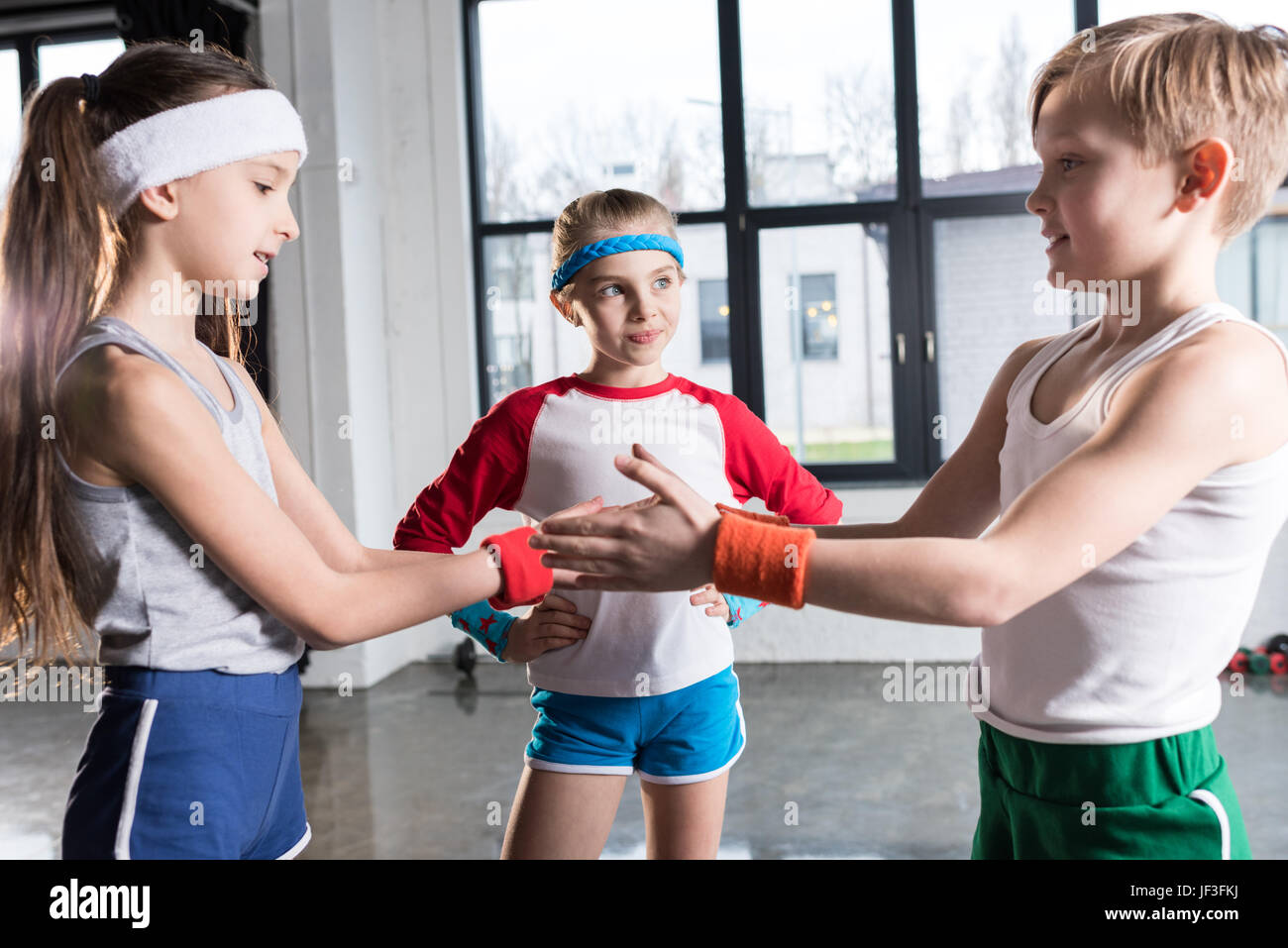 adorable funny kids in sportswear playing at fitness studio, children ...