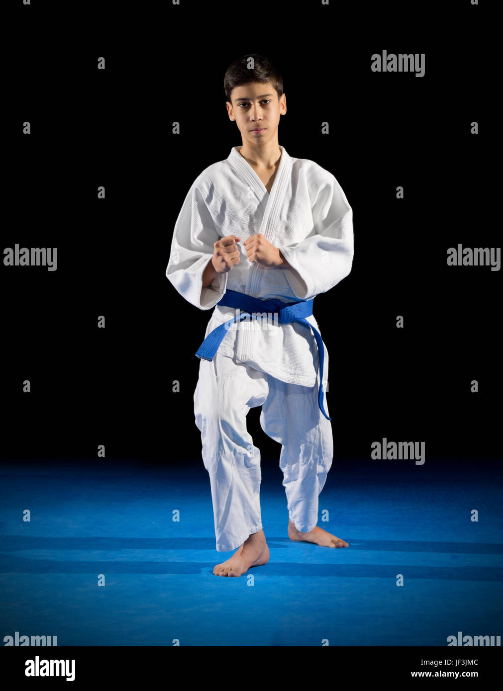 Boy martial arts fighter isolated Stock Photo - Alamy
