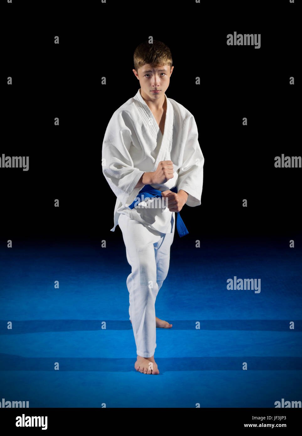 Boy martial arts fighter isolated Stock Photo - Alamy