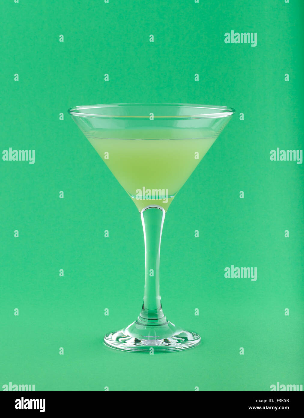 Alcoholic cocktail and beverage on greenery pantone background Stock ...