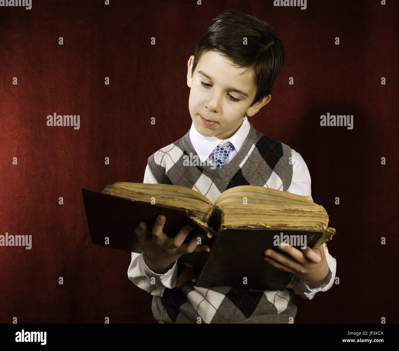 Child with red vintage book Stock Photo - Alamy