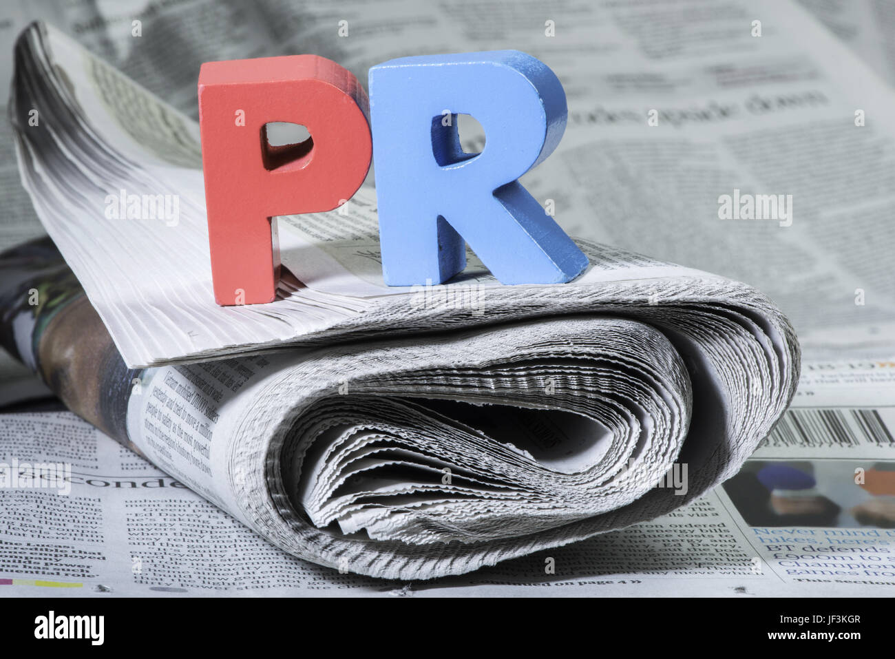 Word PR on newspaper Stock Photo - Alamy