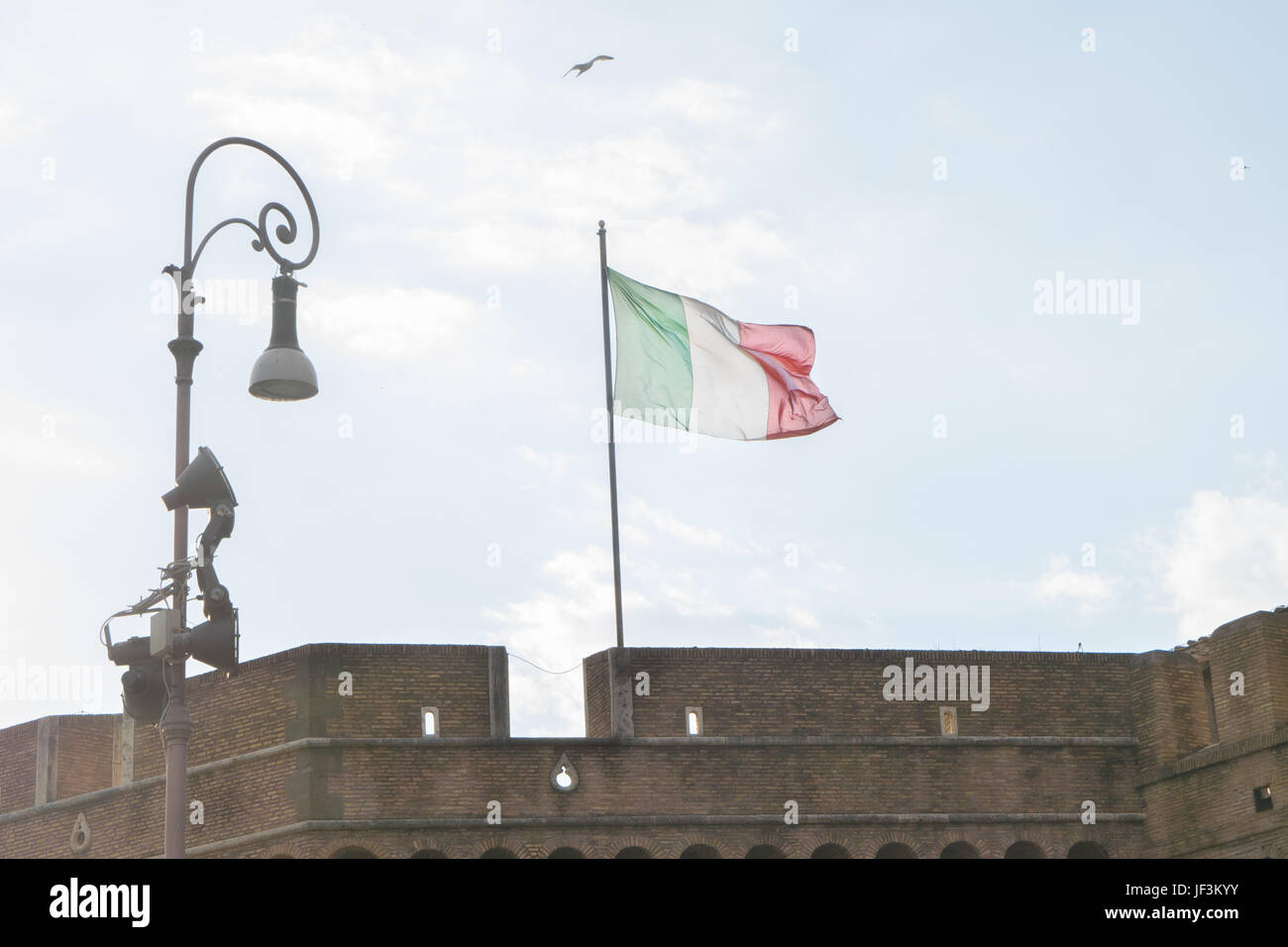 Italian flag against blue sky at Castel Sant'Angelo Stock Photo - Alamy