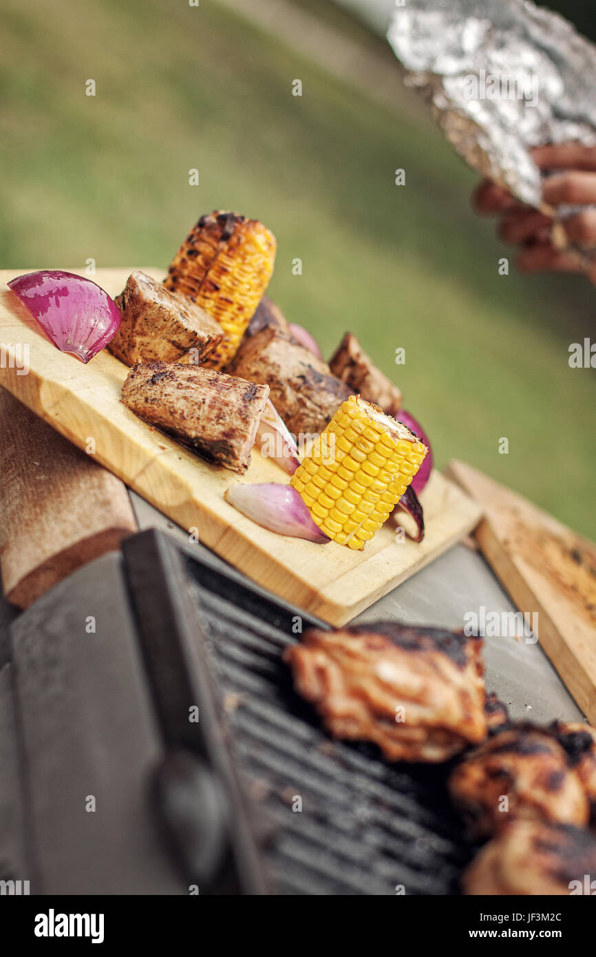 Grill barbecue party in garden. Barbecue pork medalion and vegetables ...