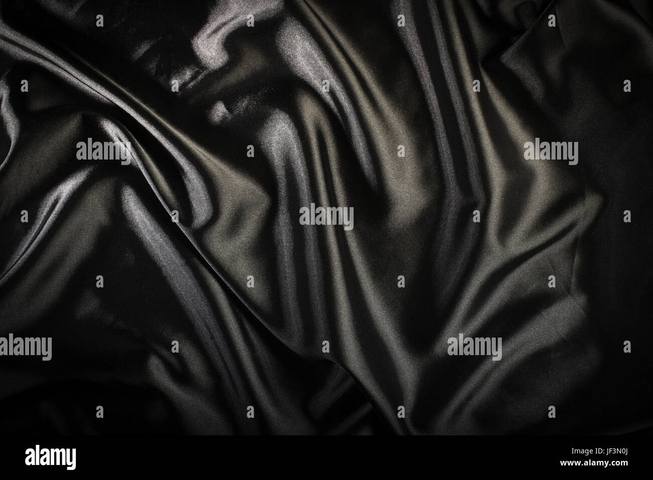 Shiny black satin fabric Stock Photo - Alamy