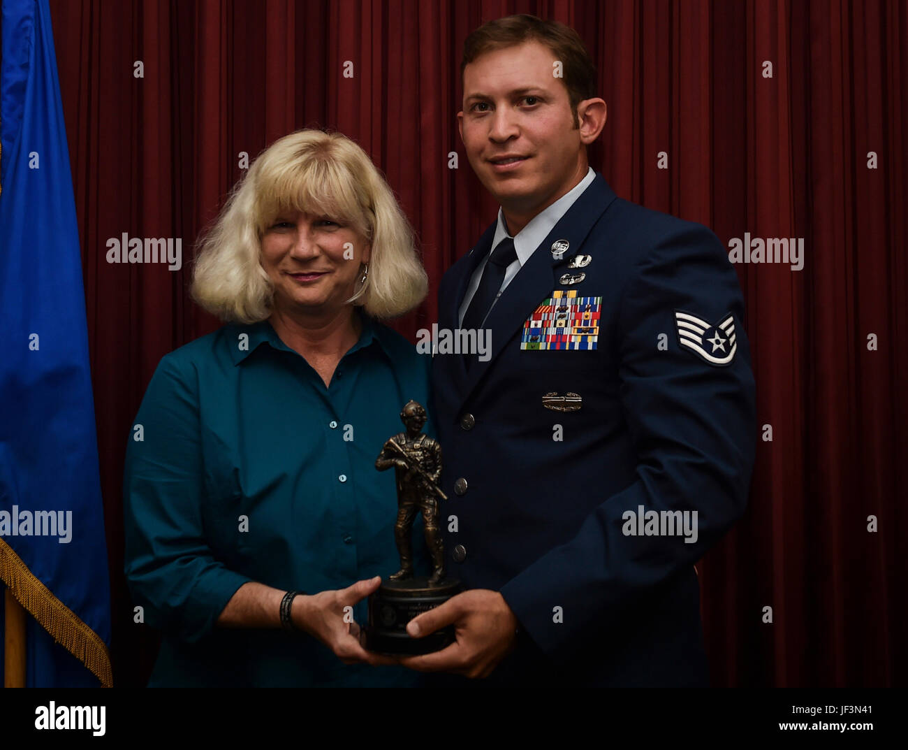 Linda Ammons, Tech. Sgt. Timothy Officer Jr’s mother, presents Staff ...