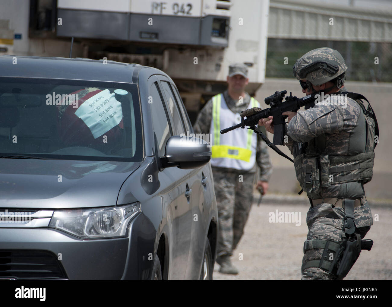 A 387th Expeditionary Security Forces Squadron member locates and ...