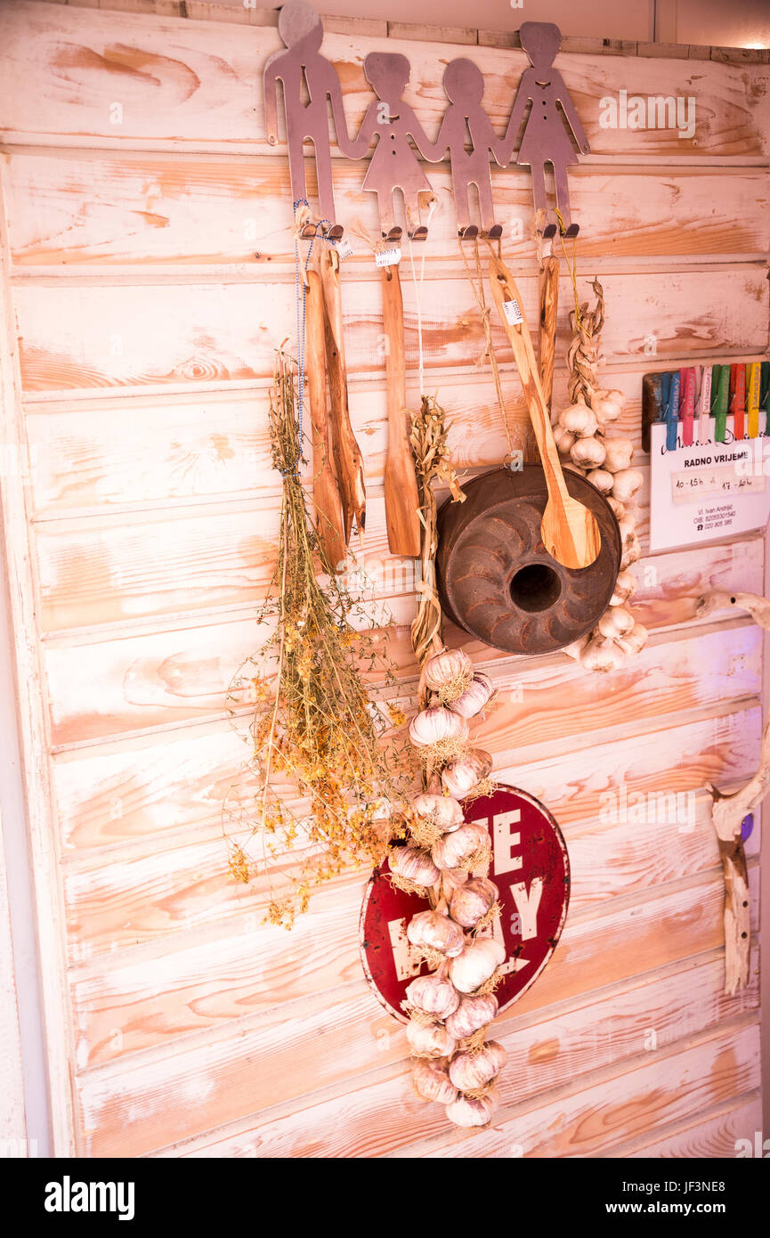 A shop front in the Old Town is lined with garlic and decorations in ...